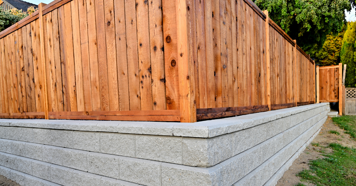 Enhance Your Landscape with a Durable Retaining Wall Fence